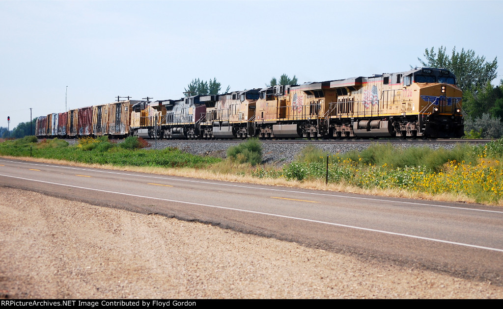UP 7726 leaes westbound freight